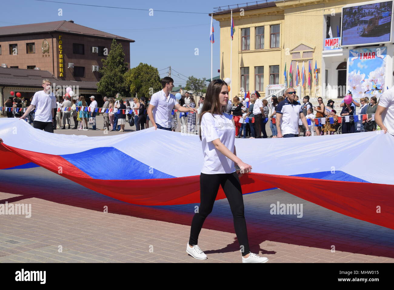 Slavyansk-on-Kuban, Russia - May 1, 2018: Solemn carrying of the flag ...