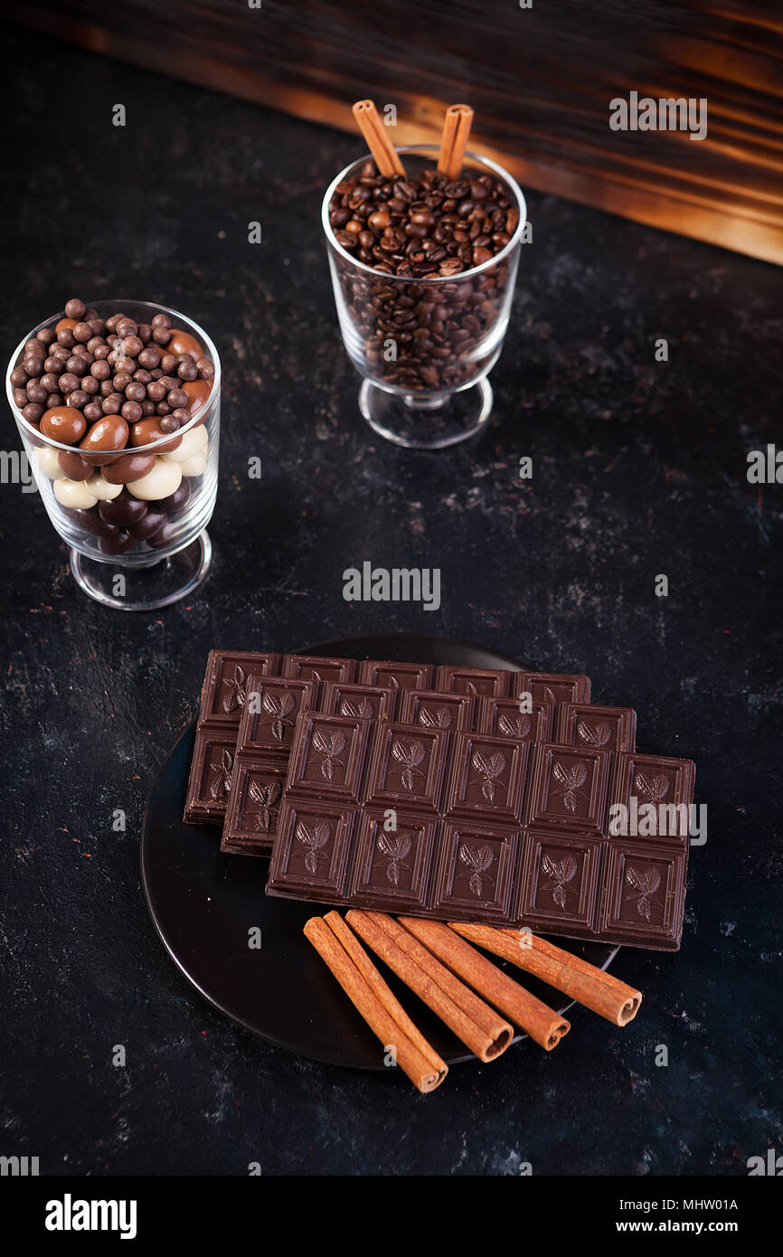 Chocolate tablet next to other candies Stock Photo - Alamy