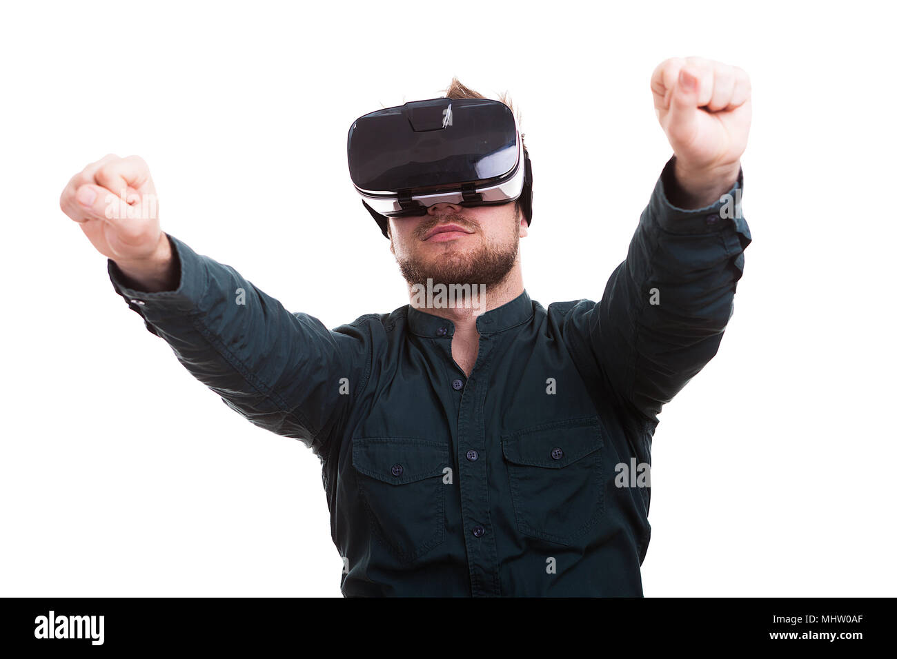 Man wearing a VR headset with his hands in the air Stock Photo - Alamy