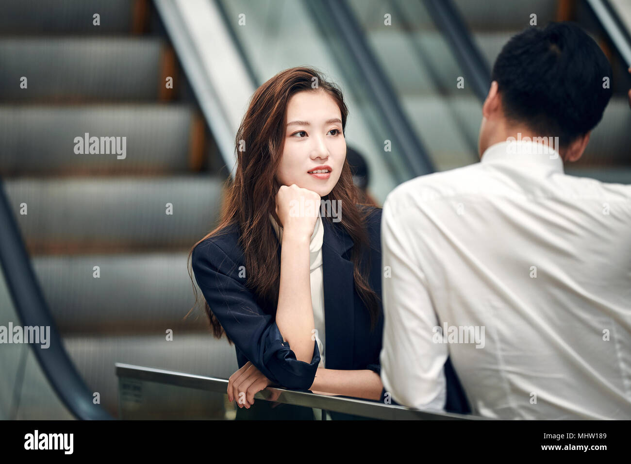 Business people talking in the elevator Stock Photo - Alamy