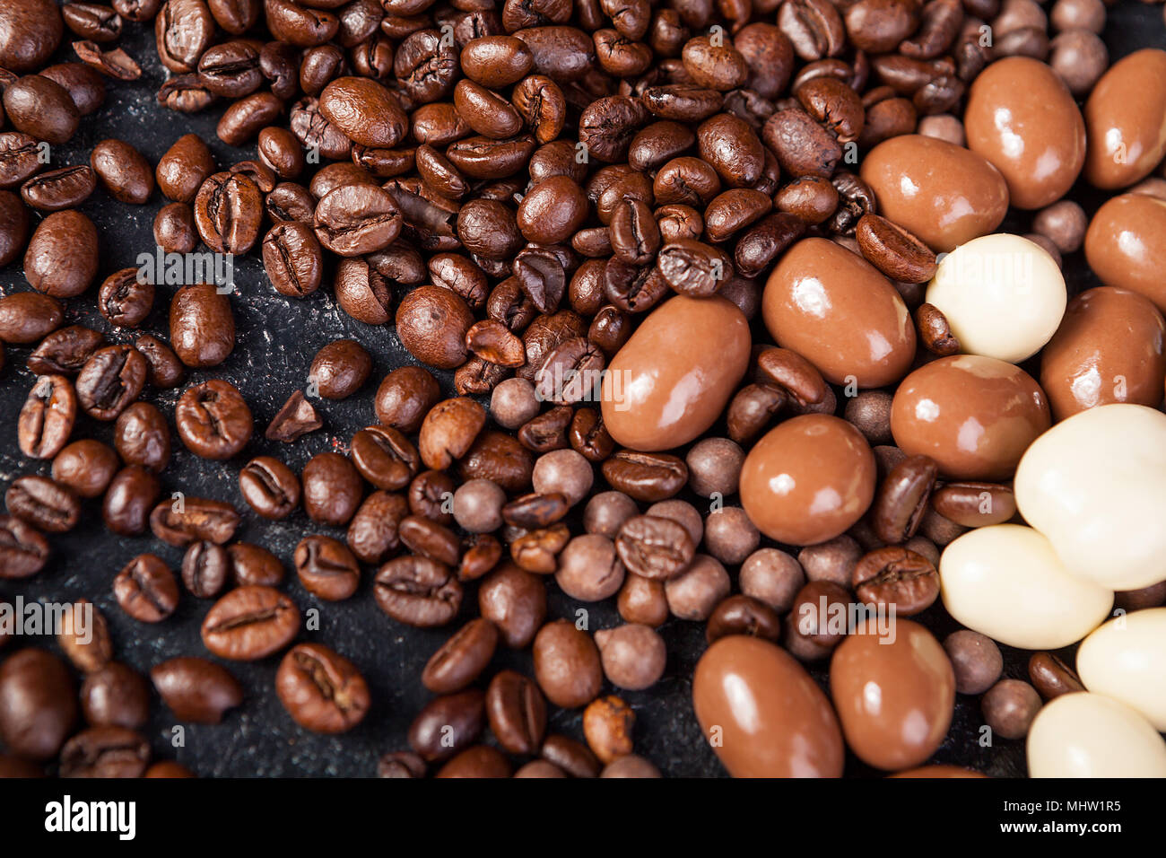 Close up of coffee beans and peanuts in chocolate Stock Photo - Alamy