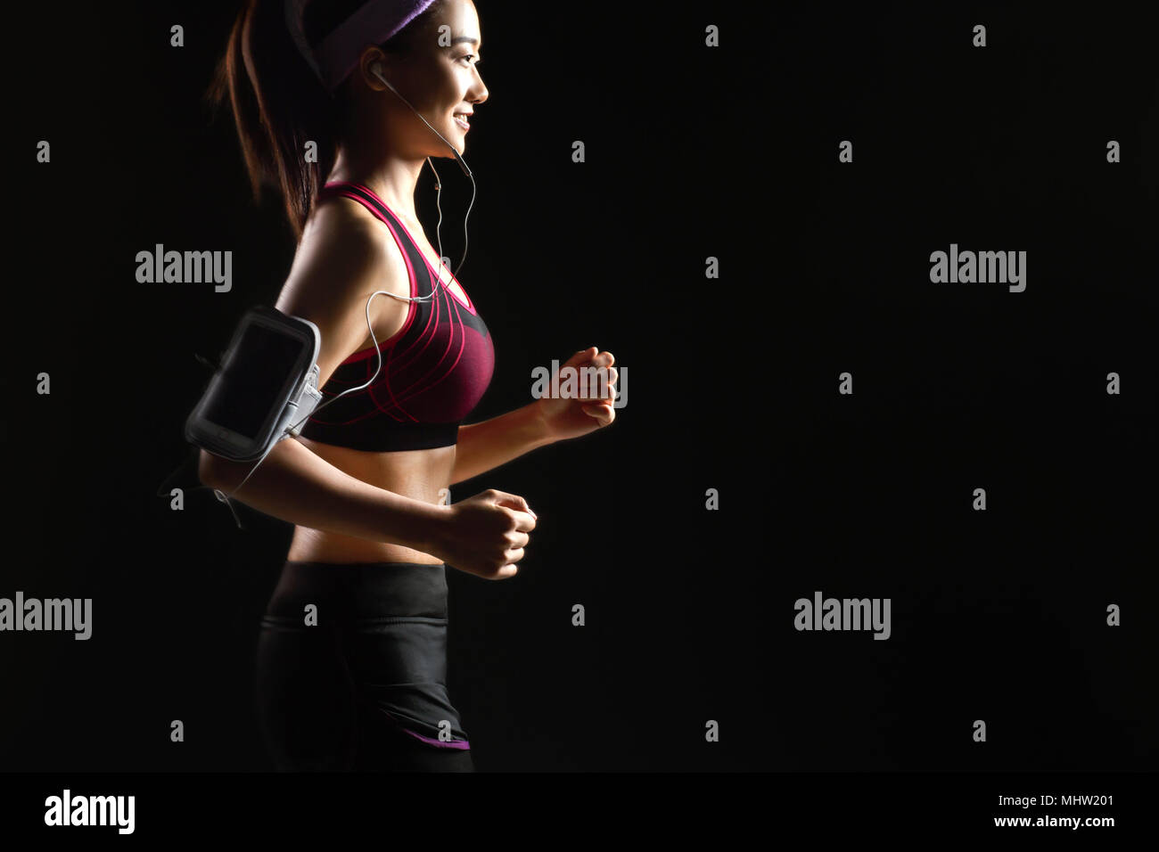 Young woman running Stock Photo - Alamy