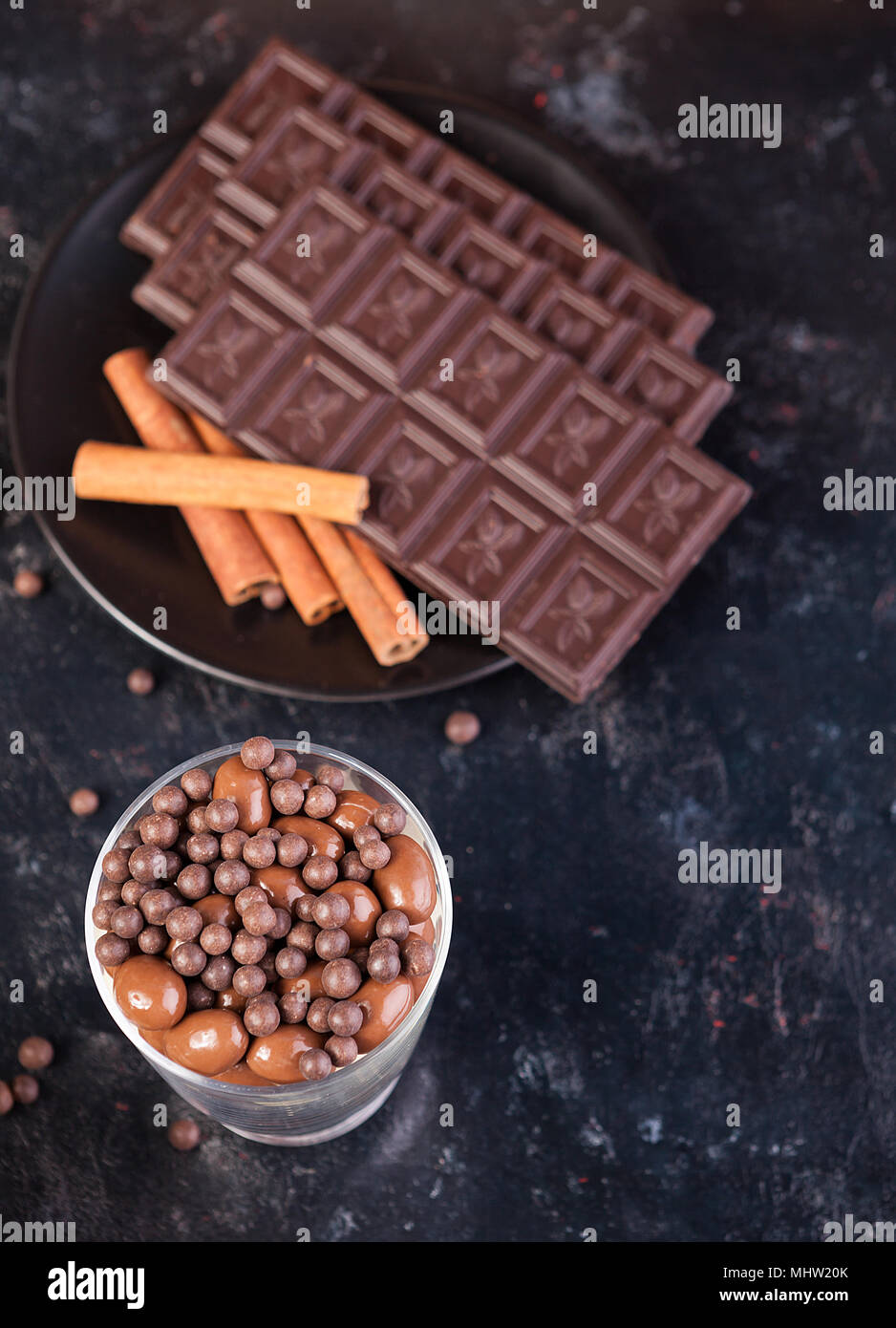 Chocolate tablet next to other candies Stock Photo - Alamy
