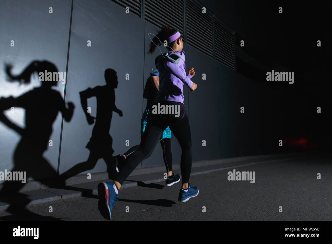 Two women running away hi-res stock photography and images - Alamy