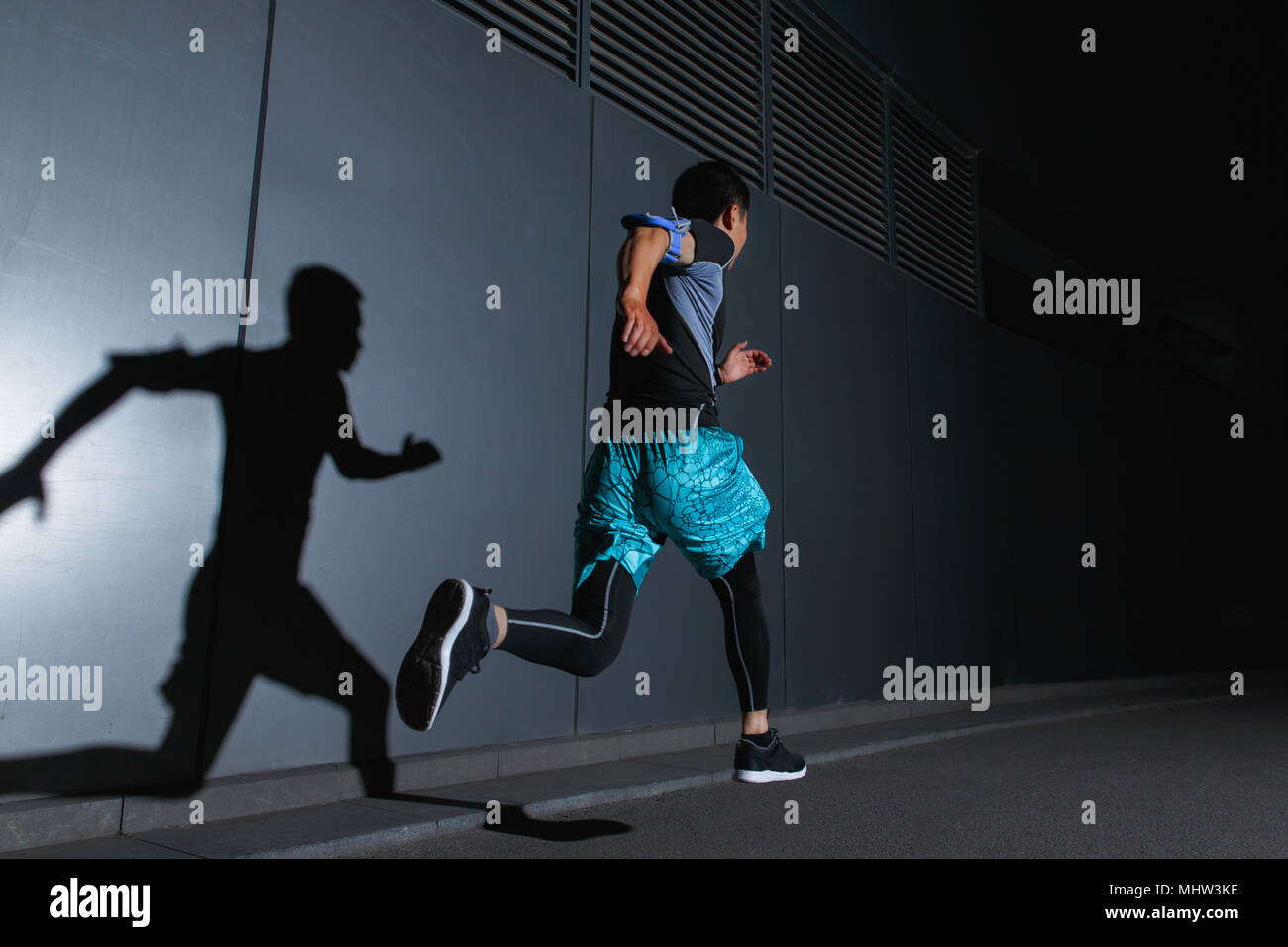 A man running outdoors Stock Photo - Alamy