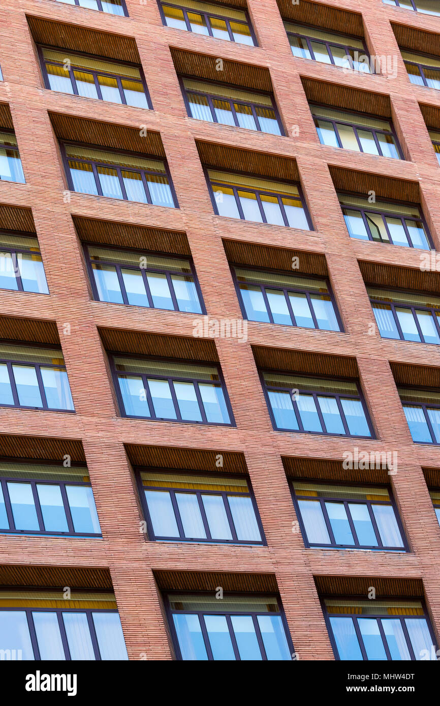 Background of the windows and balconies of the multi-storey building ...