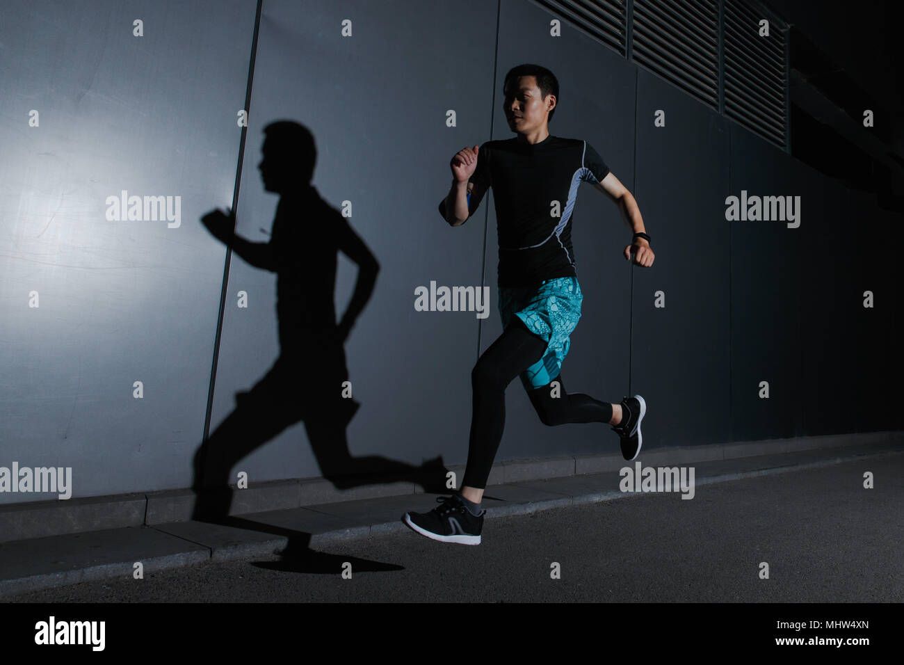Man running away night hi-res stock photography and images - Alamy
