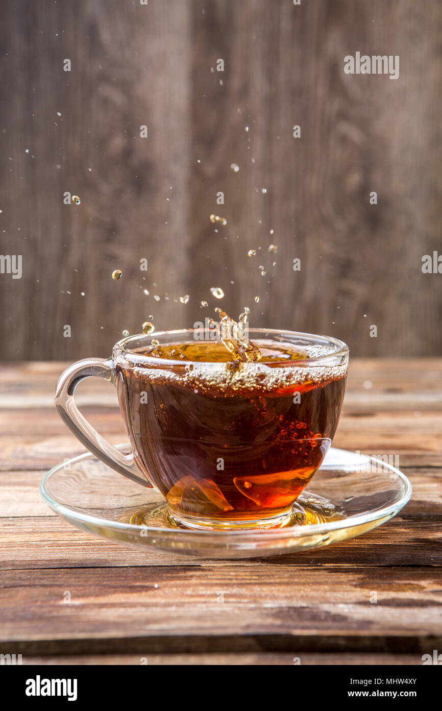 Spill of black hot tea Stock Photo - Alamy