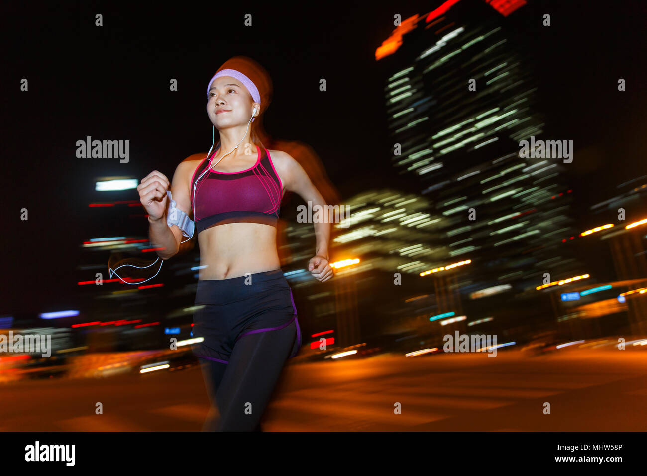 Young women running outdoors Stock Photo - Alamy