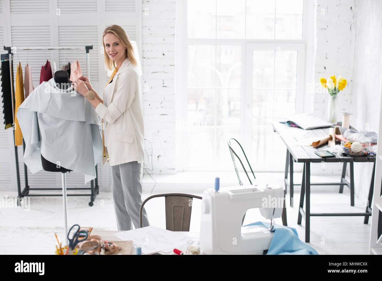 Adjusting clothes hi-res stock photography and images - Alamy