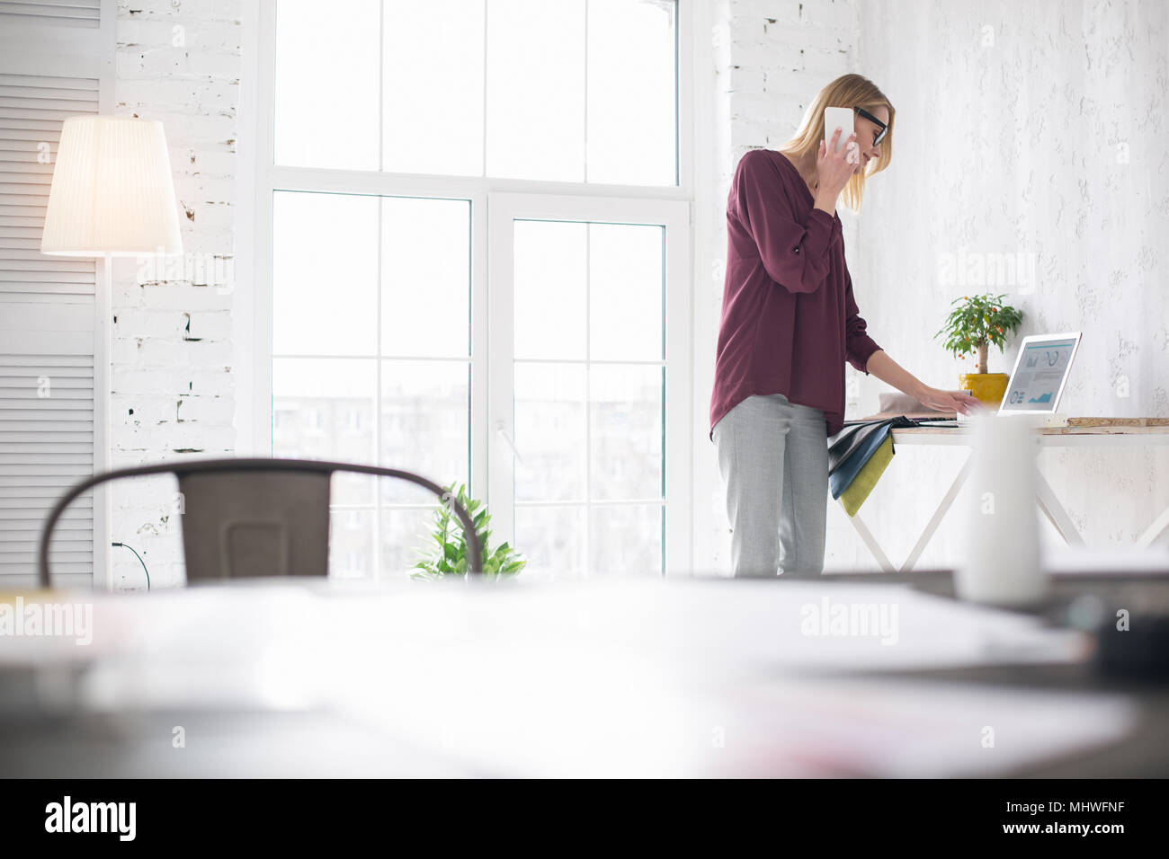 Successful female freelancer receiving order Stock Photo - Alamy