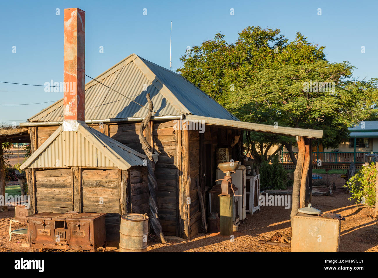 Early morning light on an old slab cottage in the museum in Windorah in ...