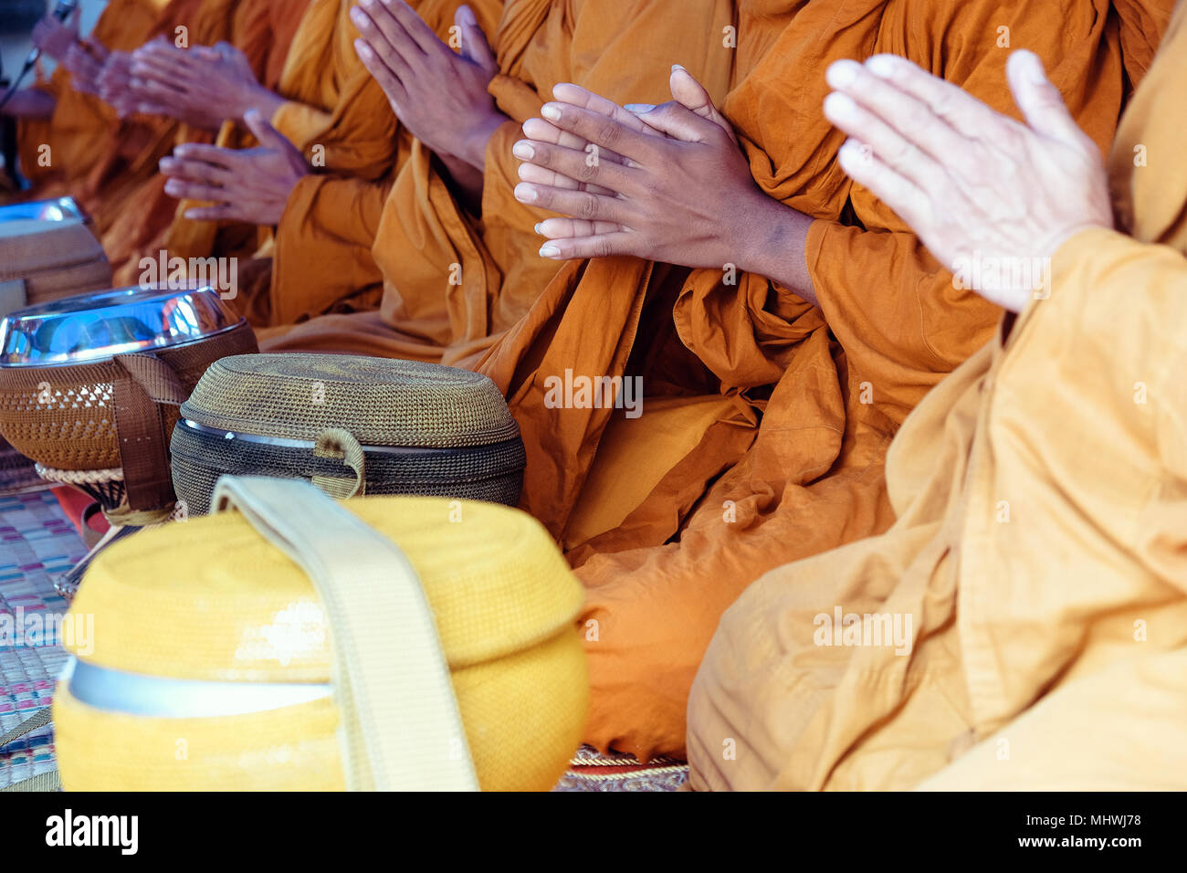 Buddhist monks praying Stock Photo - Alamy