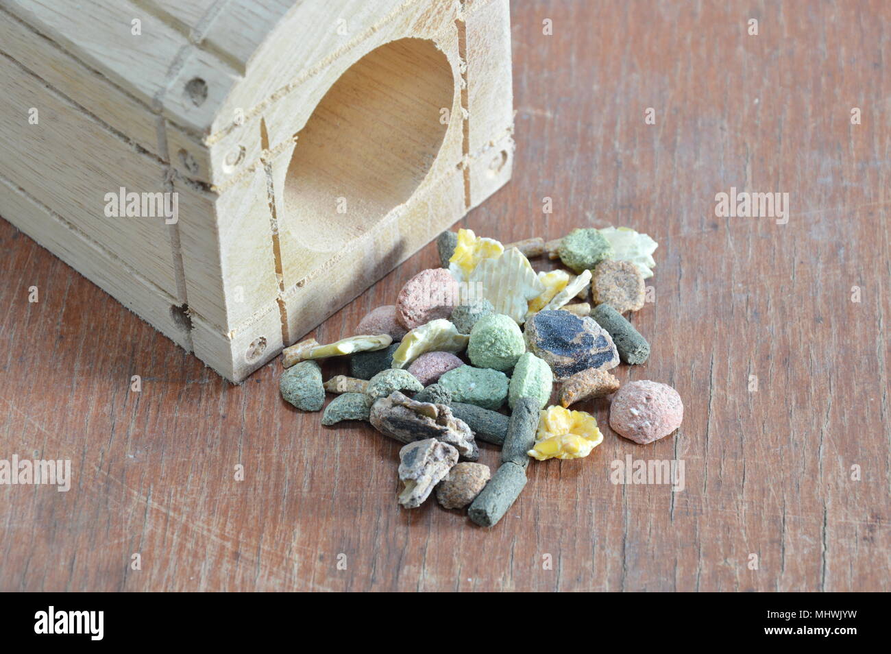 hamster food and wooden block for playing Stock Photo - Alamy