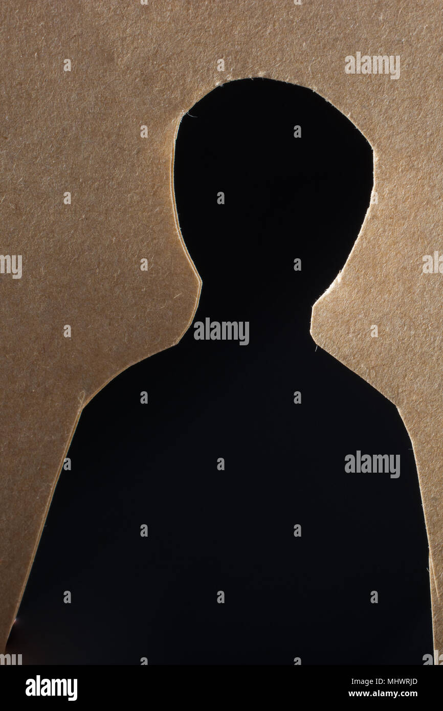 Man shape cut out of paper in hand in the view Stock Photo - Alamy