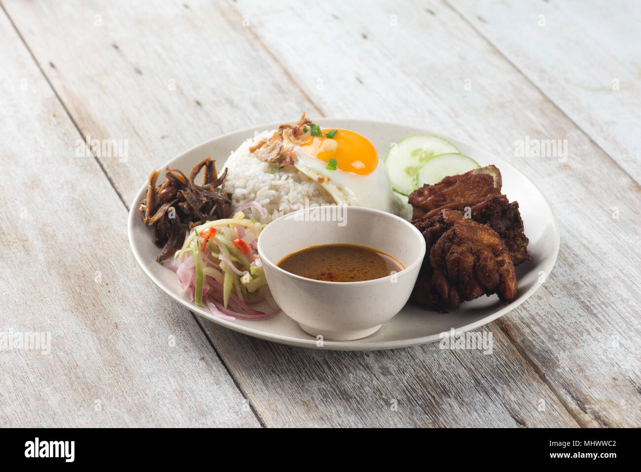 malaysian fried chicken rice with anchovies and egg Stock Photo - Alamy