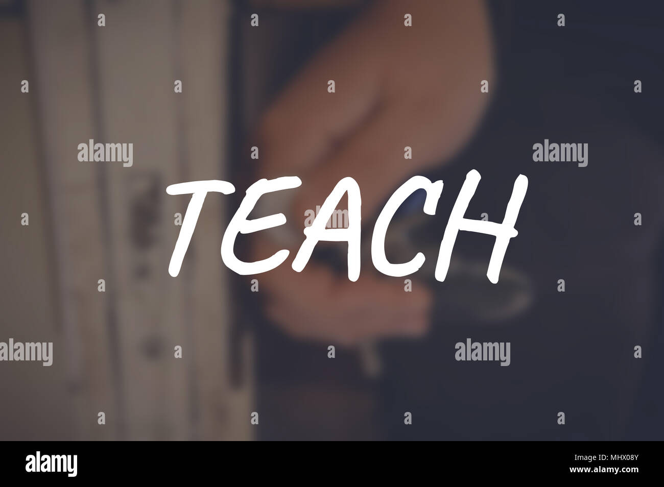 Teach word with blurring business background Stock Photo - Alamy