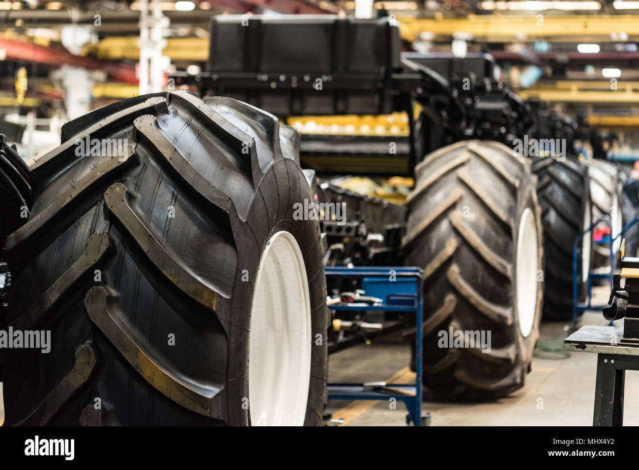 Assembly room at big industrial plant manufacturing tractors and ...