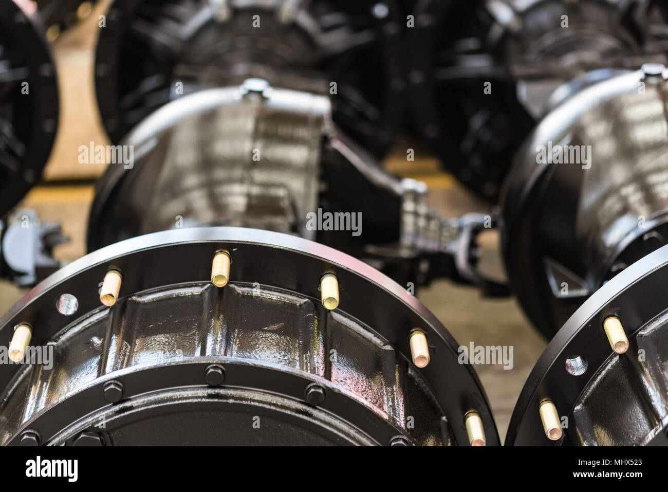 Close-up of large black tractor or combine harvester axle. Assembly ...