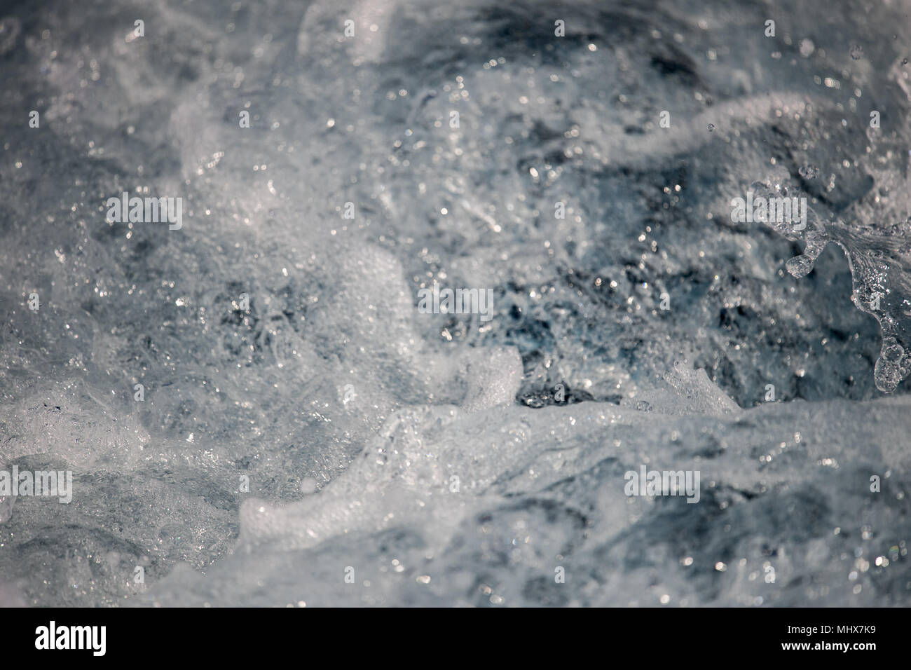 Moving effect on foam of Blue ocean waves background texture detail ...