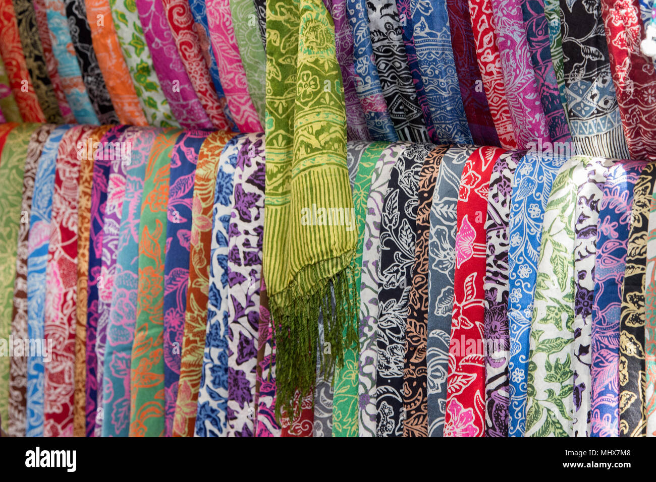different colors polo shirt on display stand Stock Photo - Alamy