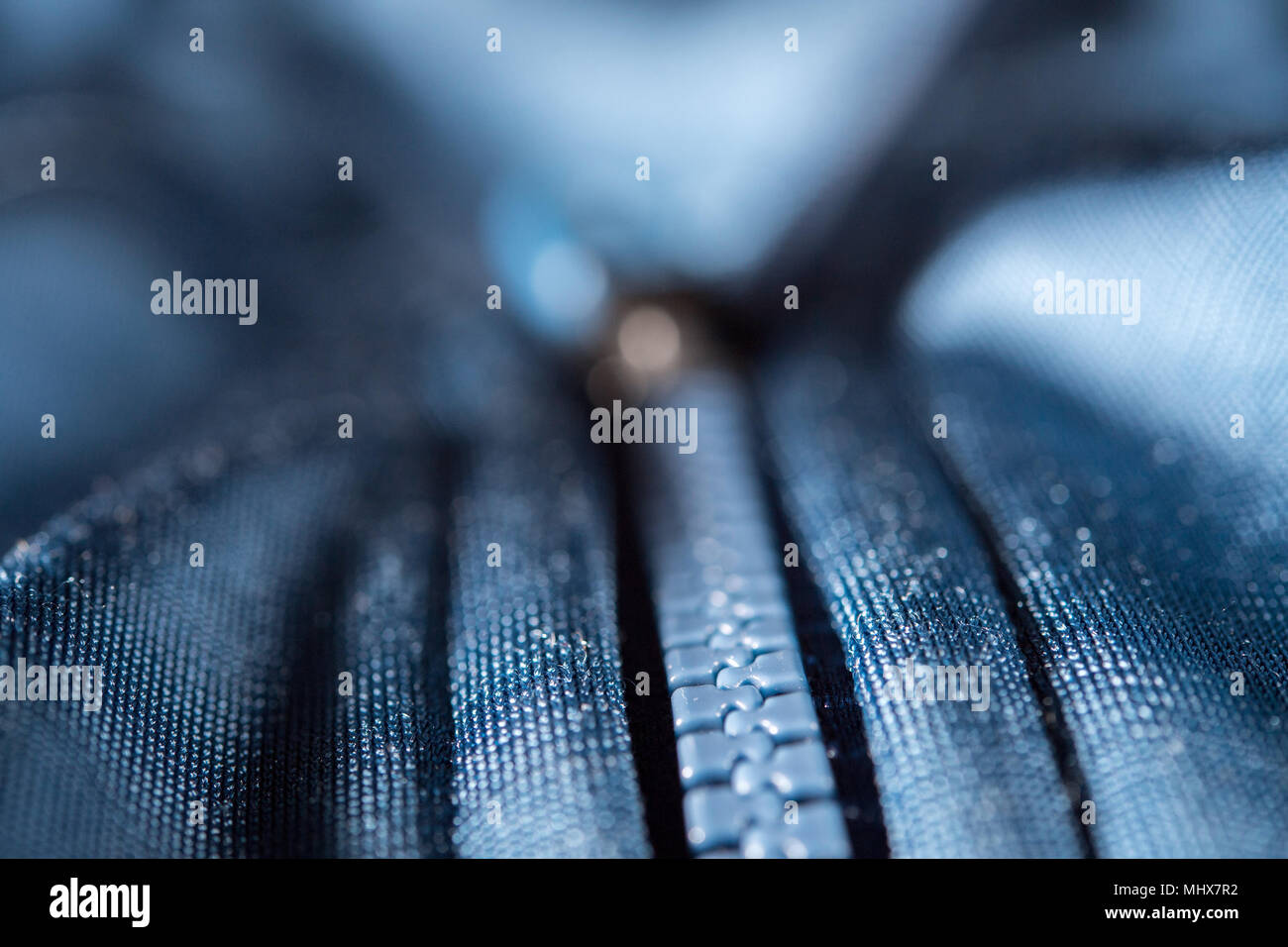 zip close up macro on clothes background Stock Photo - Alamy