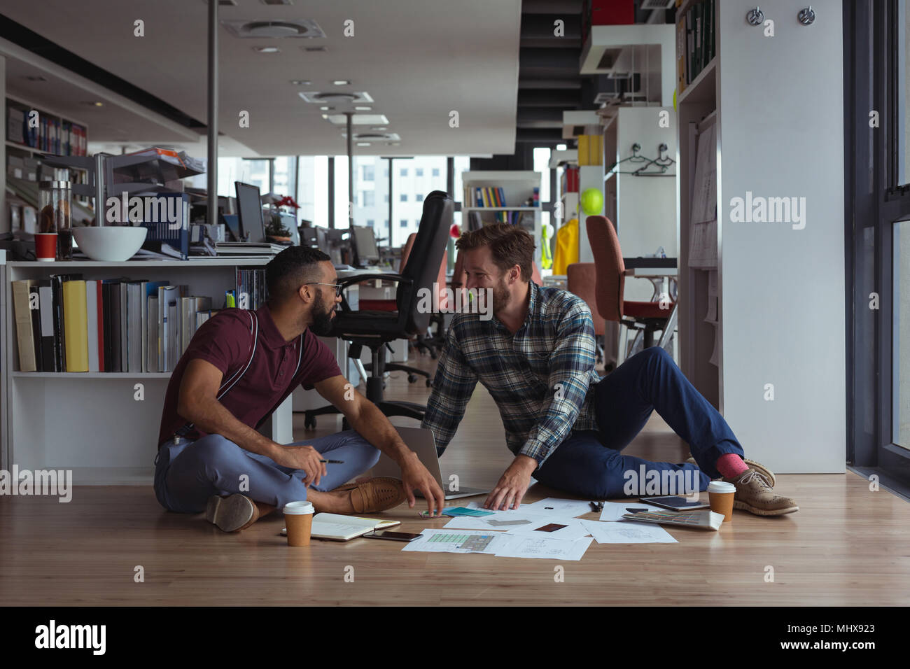 Smiling friends interacting other hi-res stock photography and images ...