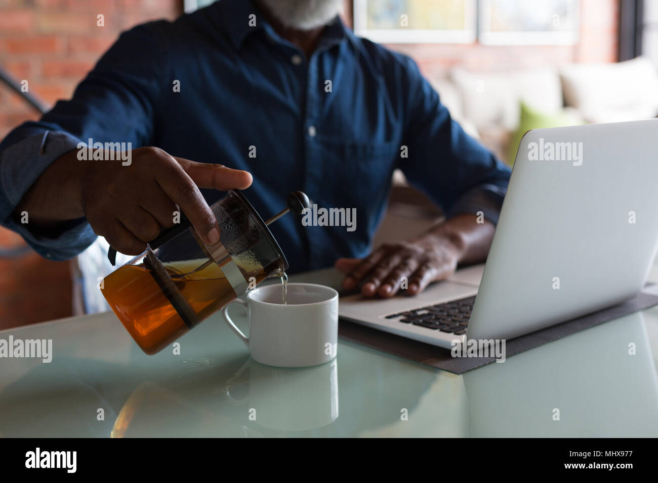 Senior man pouring coffee hi-res stock photography and images - Alamy