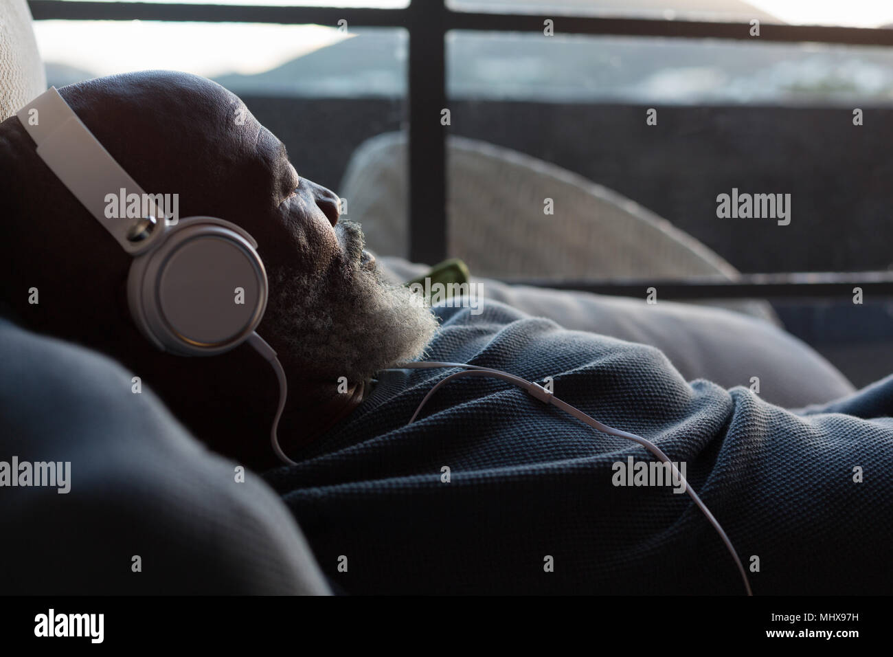 Black man resting listening music hi-res stock photography and images ...