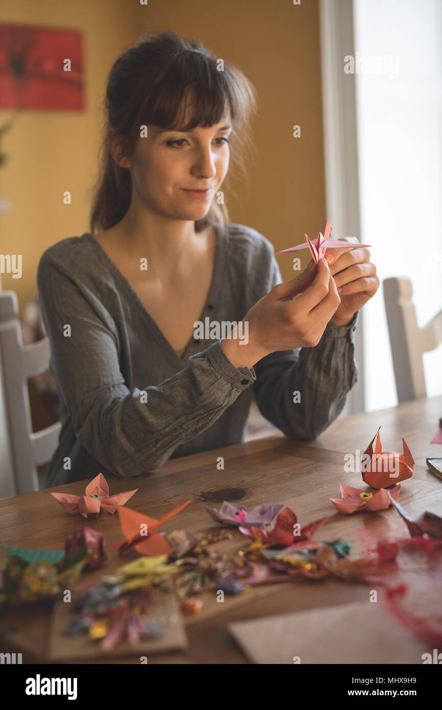 Beautiful woman preparing a paper craft at home Stock Photo - Alamy