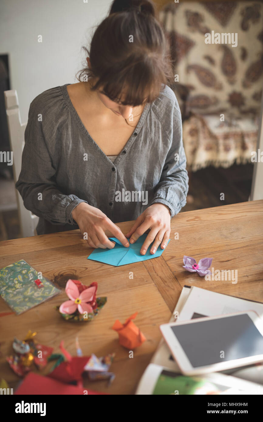Beautiful woman preparing a paper craft Stock Photo - Alamy