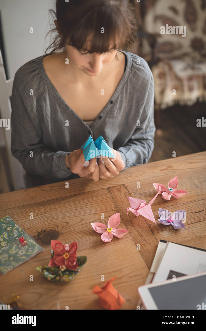 Woman folding paper origami hi-res stock photography and images - Alamy