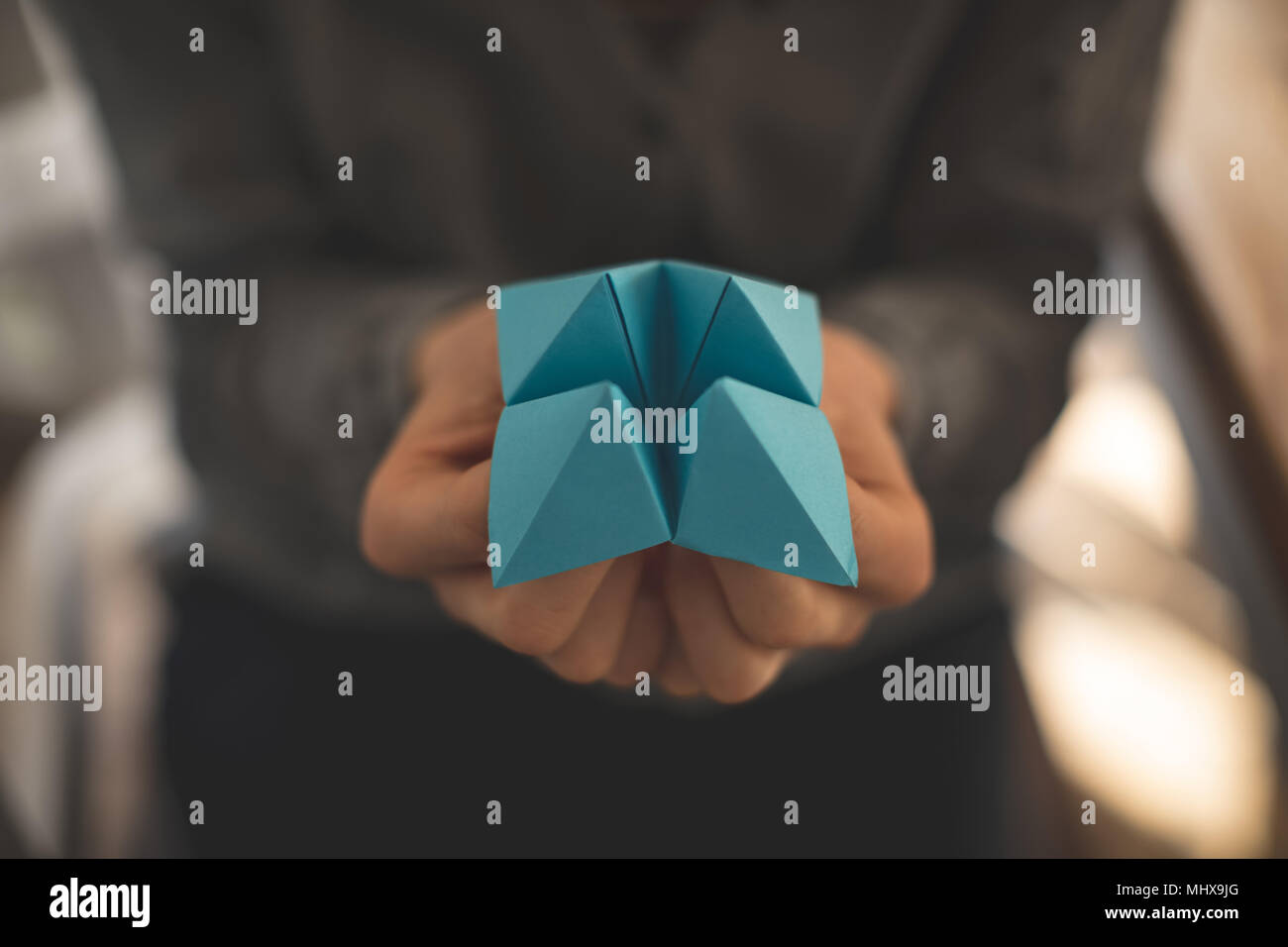 Women showing origami at home Stock Photo - Alamy