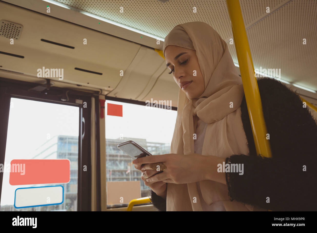 Using phone on bus hi-res stock photography and images - Alamy