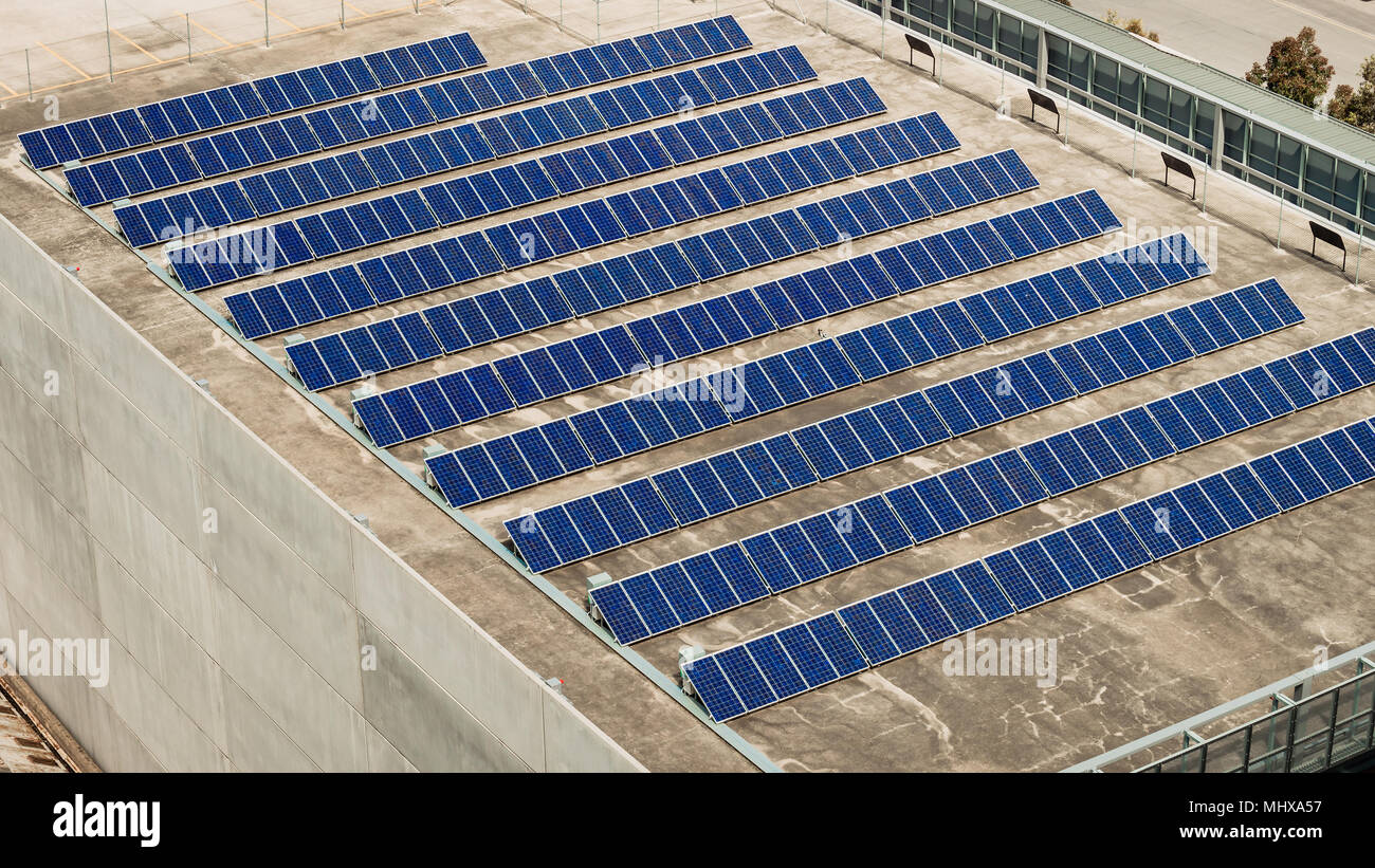 Solar panel farm set up on building roof in South Australia Stock Photo ...