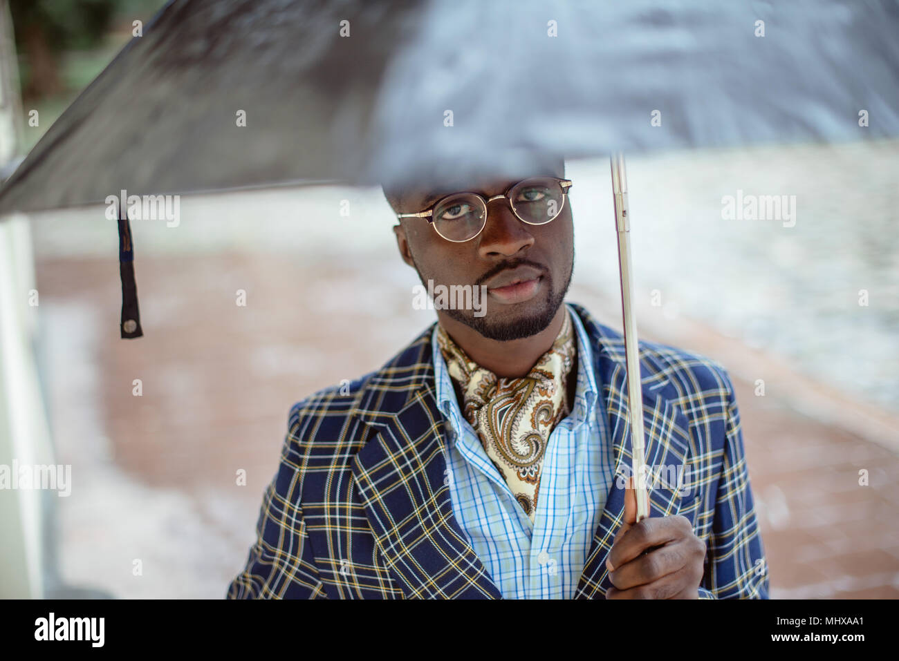 Street portrait man in city with umbrella Stock Photo - Alamy