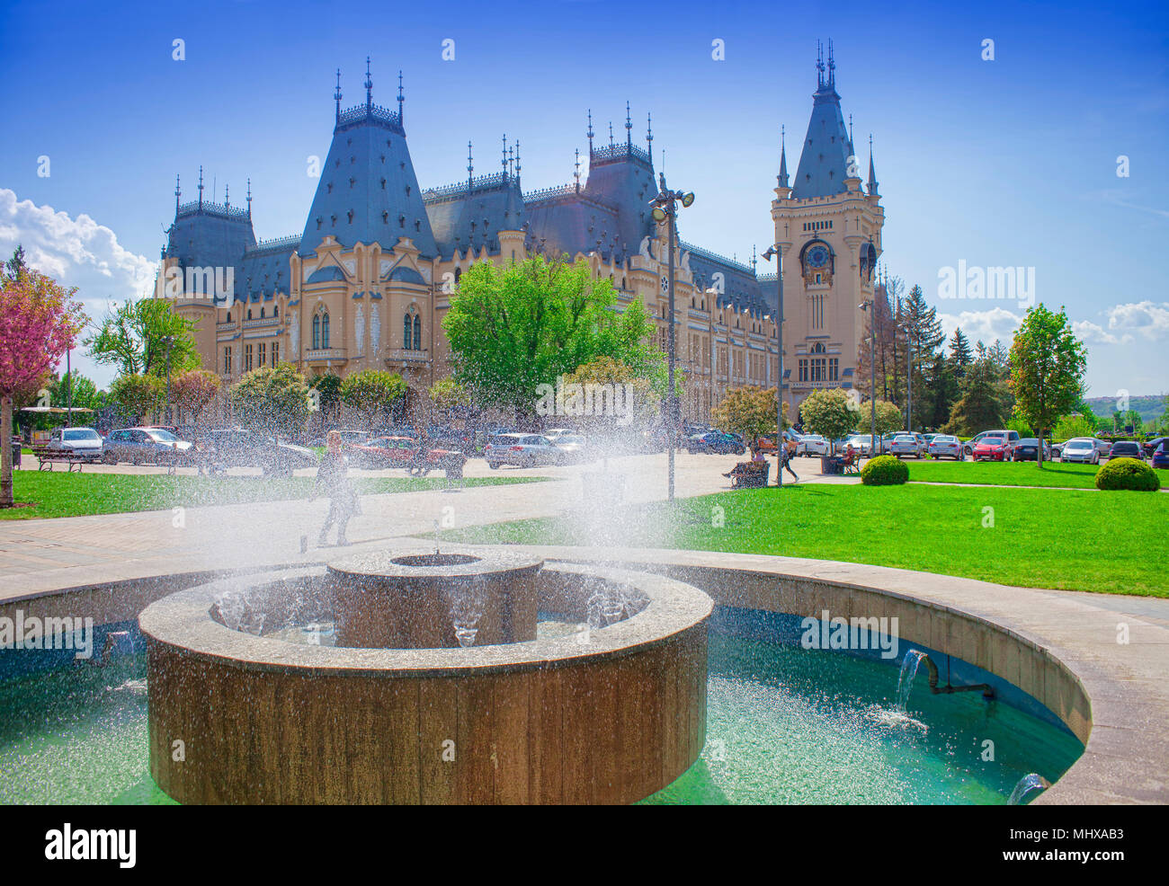 the Palace of Culture in Iasi city, Romania. green park and blue sky ...