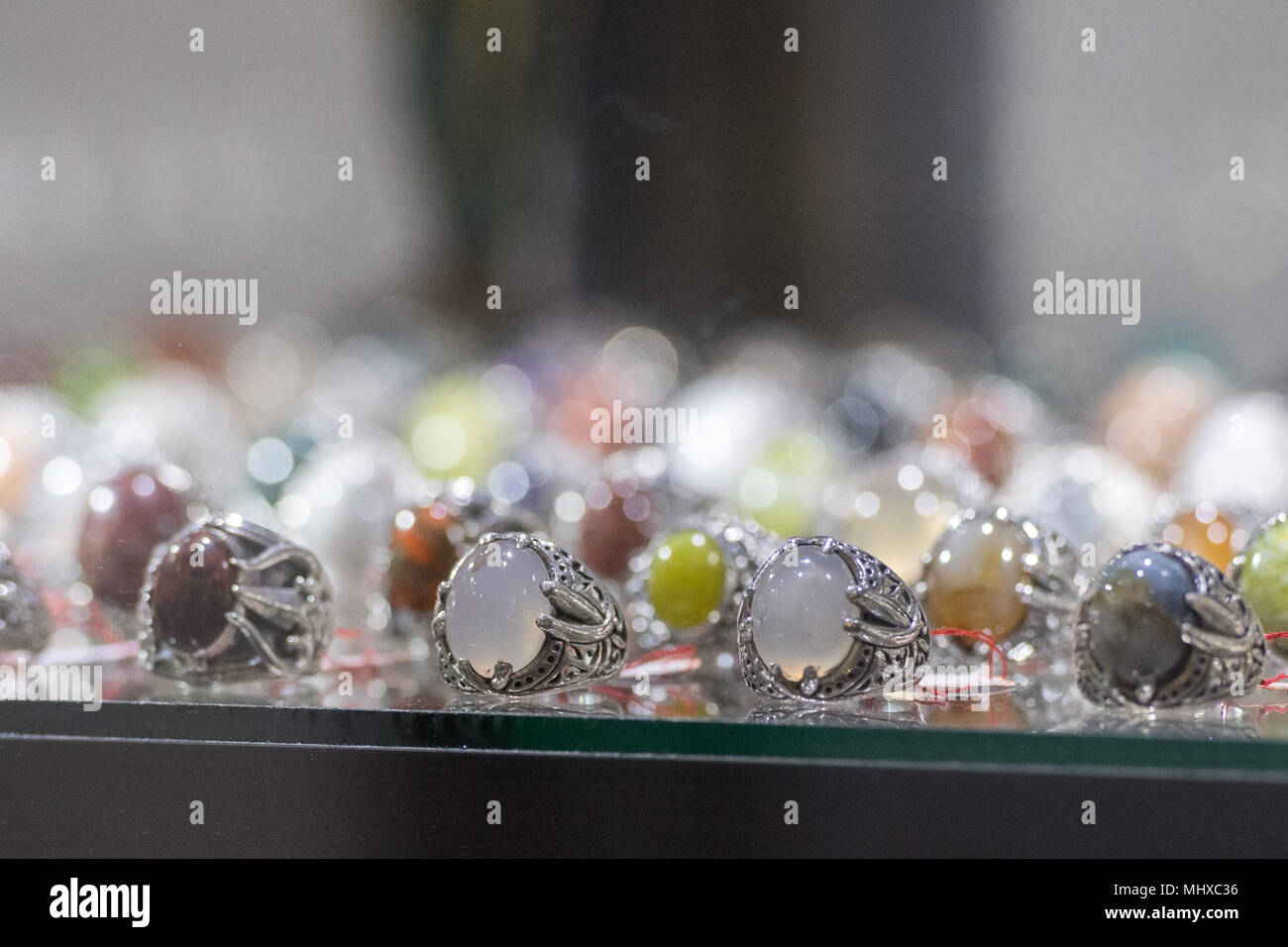 hand made silver rings on display stand for sale asian style Stock ...