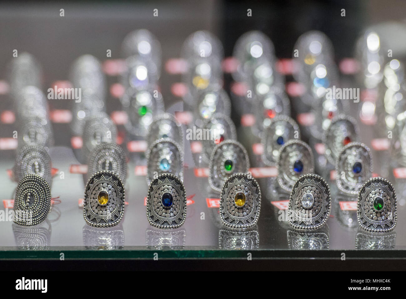 hand made silver rings on display stand for sale asian style Stock ...