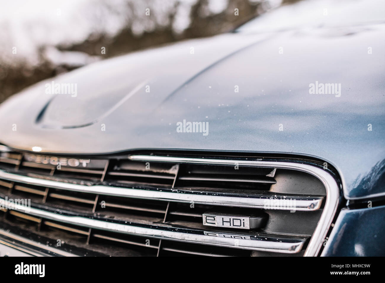 Blue car without a trade brand on winter road Stock Photo - Alamy