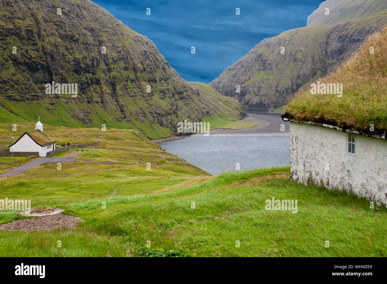Faer Oer Island view on cloudy background Stock Photo - Alamy