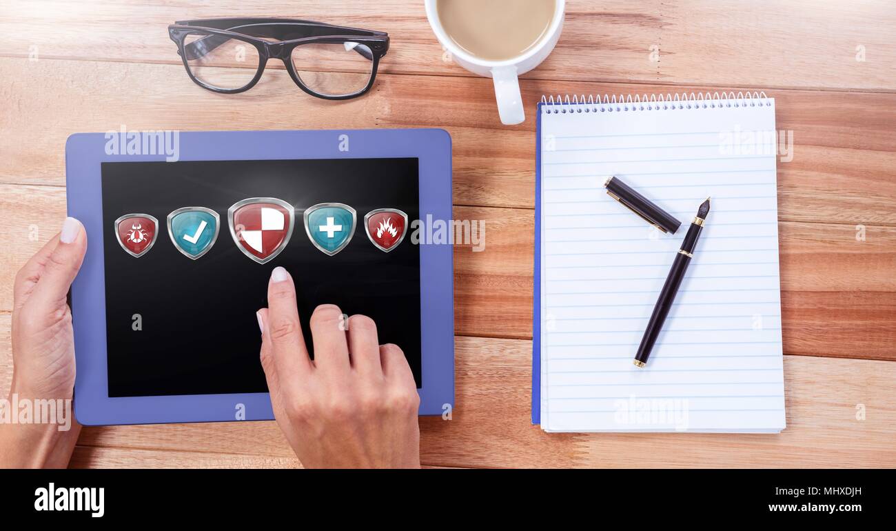 Antivirus security protection shield on tablet Stock Photo - Alamy