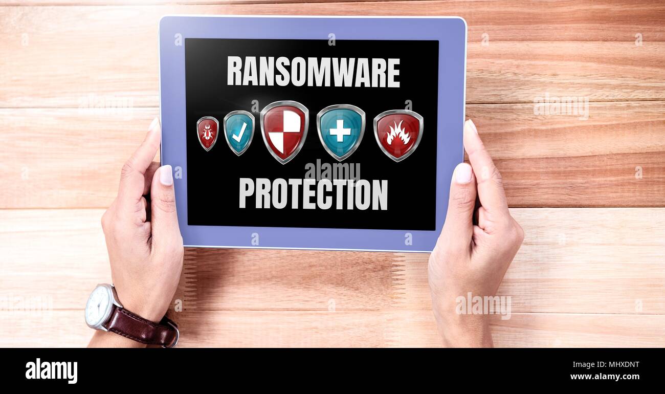 Ransomware protection shields on tablet Stock Photo - Alamy