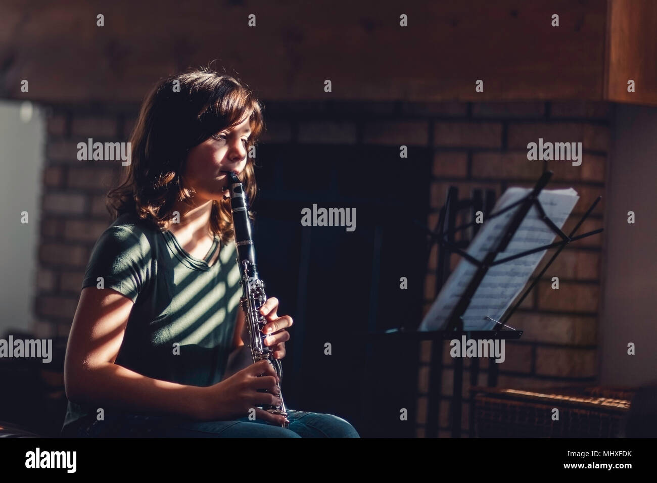 Girl playing clarinet hi-res stock photography and images - Alamy
