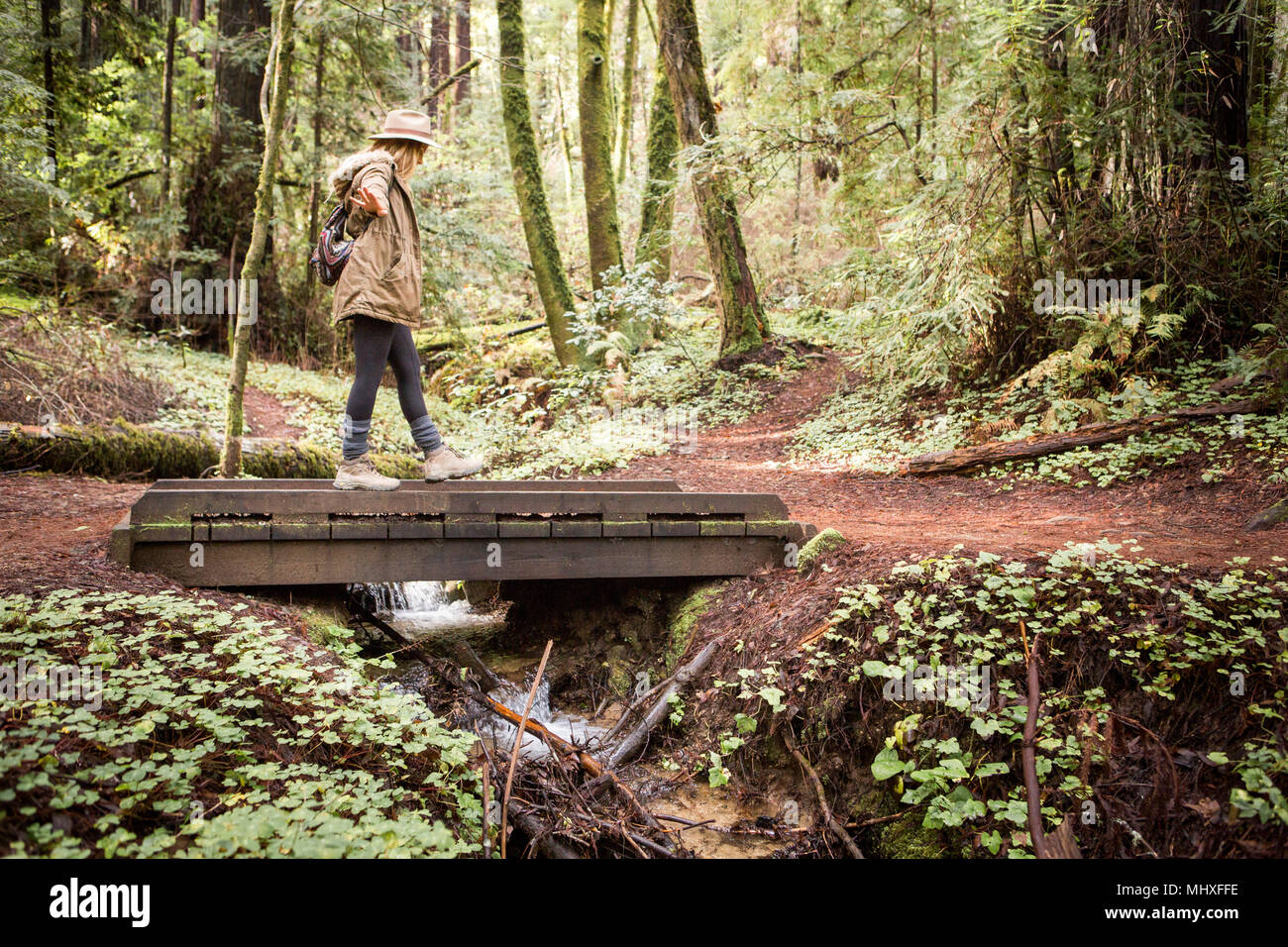 Woman balancing on bridge hi-res stock photography and images - Alamy