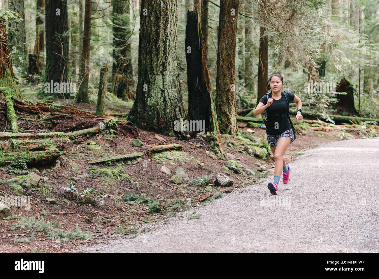 Girl running in the forest hi-res stock photography and images - Alamy
