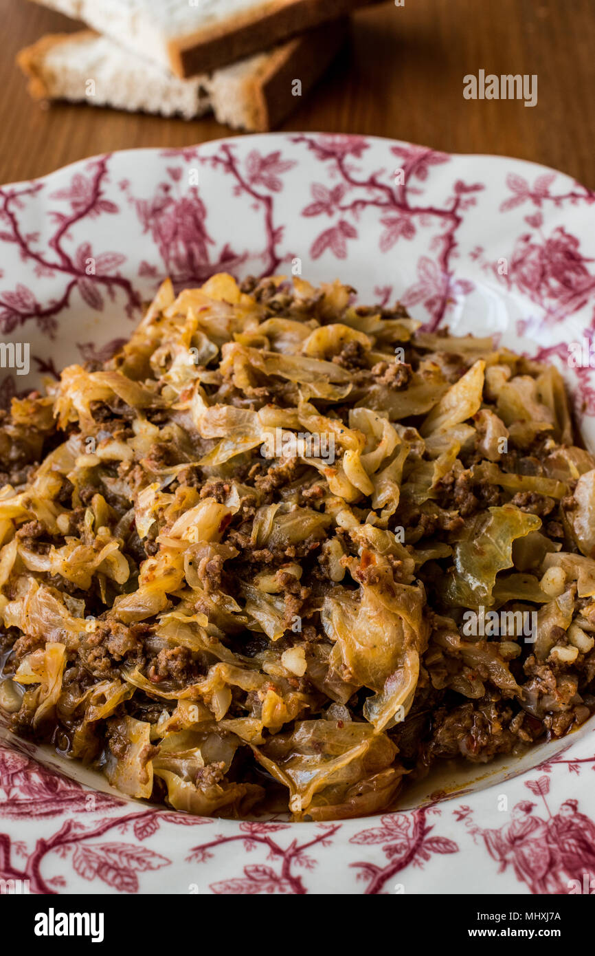 Turkish Cabbage Stew with minced meat / Kiymali Kapuska on a wooden ...