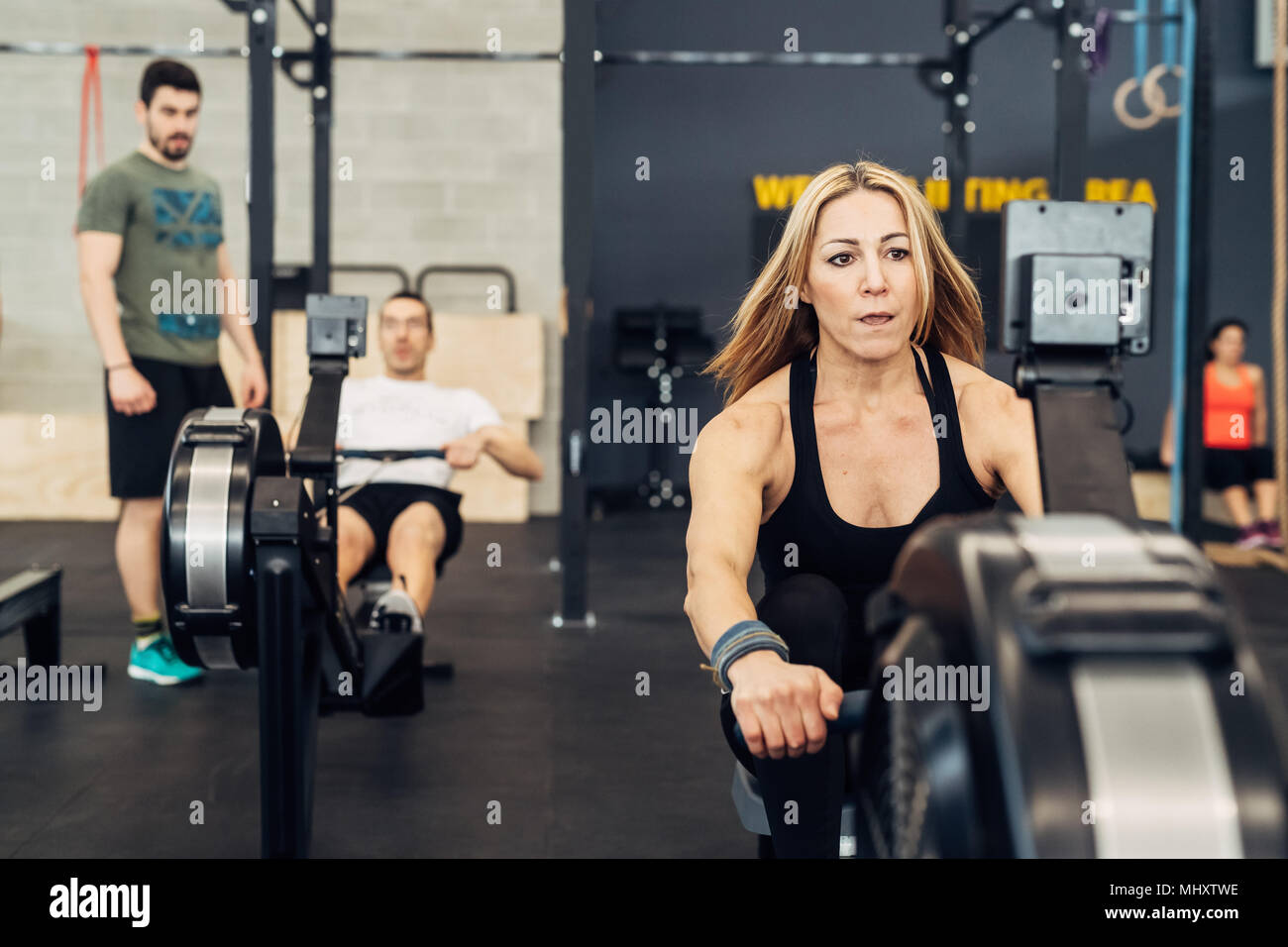 Rowing machine woman hi-res stock photography and images - Alamy
