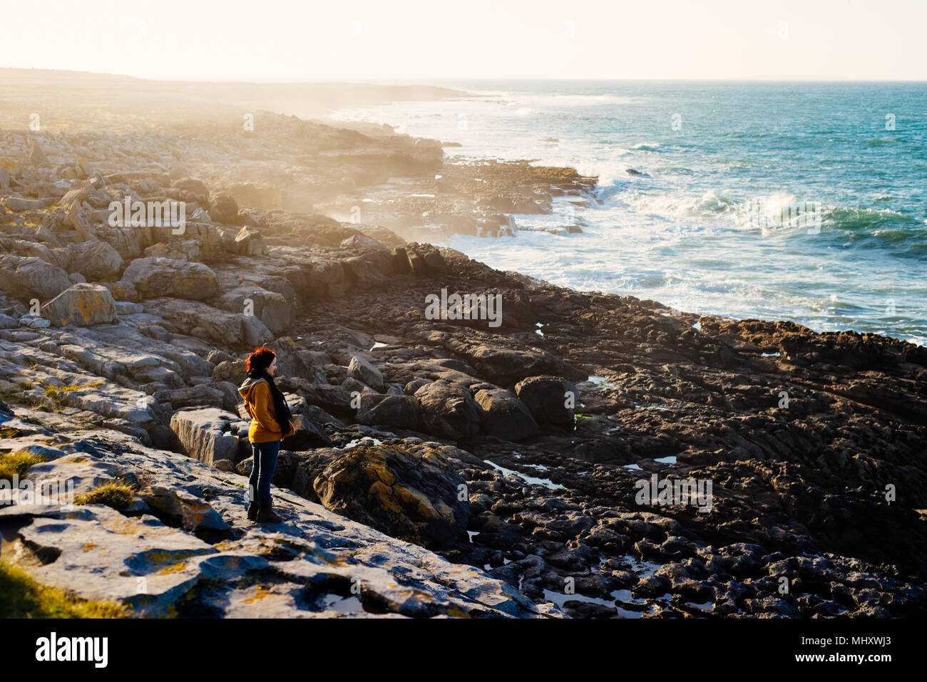 Woman looking out to sea hi-res stock photography and images - Alamy