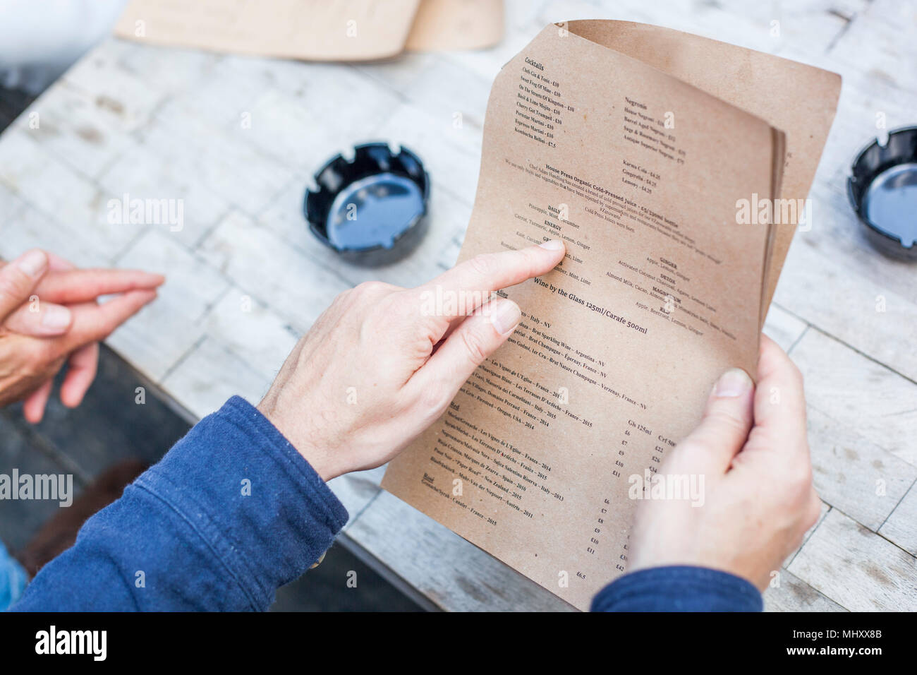 Man pointing at menu Stock Photo - Alamy